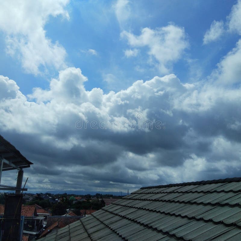 Sunshine and Cloudy View on the Rooftop Stock Photo - Image of sunshine ...