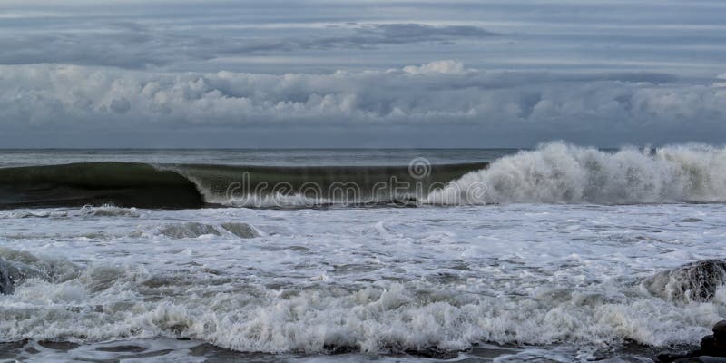 Sunshine Coast with Crashing Waves during a Storm Under a Blue Cloudy ...
