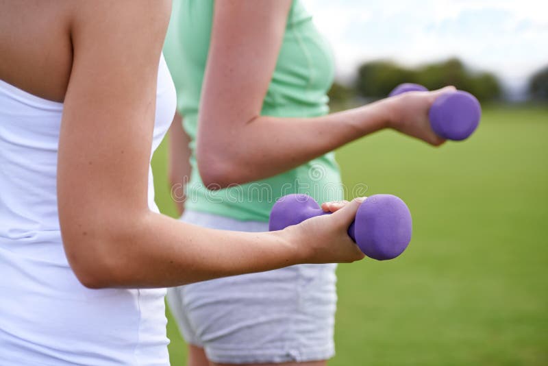Sunshine and Exercise. a Group of Young Women Exercising Outdoors ...