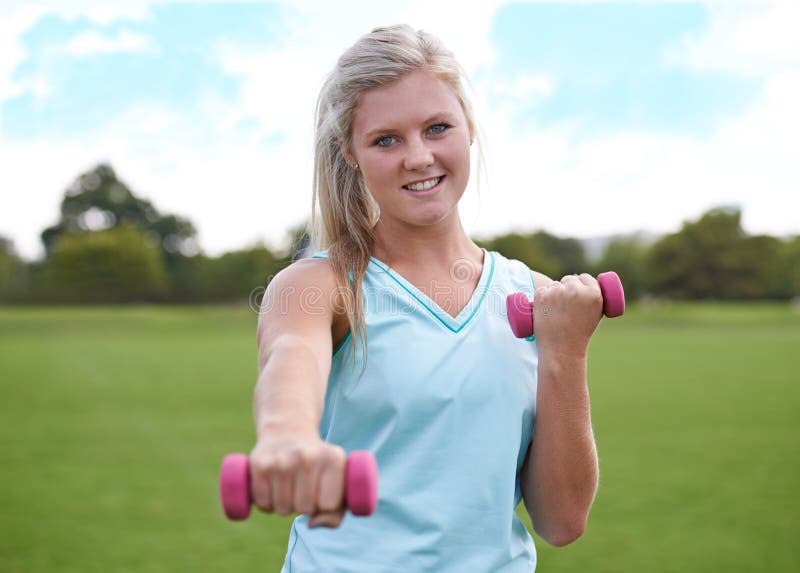 Sunshine and Exercise. a Group of Young Women Exercising Outdoors ...