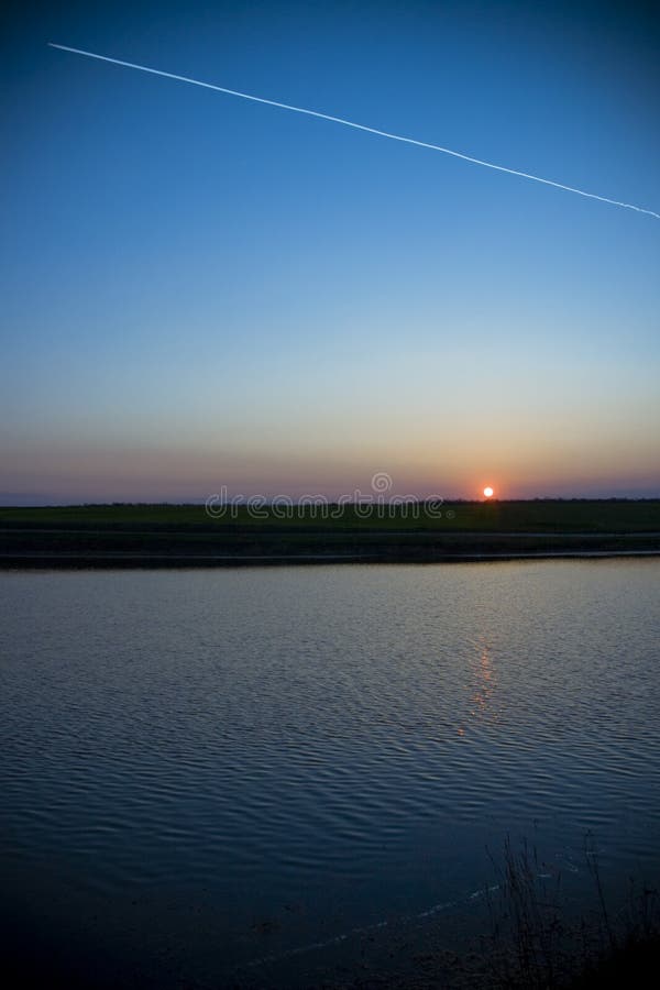 Sunshine over lake stock photo. Image of dusk, sunrise - 2293700