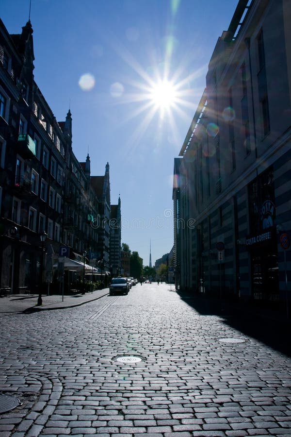 Sunshine in the street stock image. Image of sunday, riga - 21980877