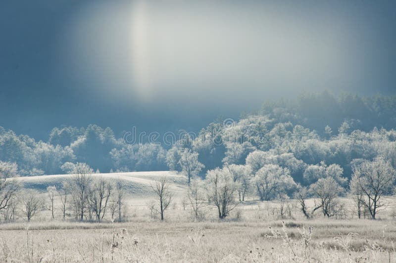 Sunstreaks Shining on Frosted Landscape Stock Image - Image of melting ...