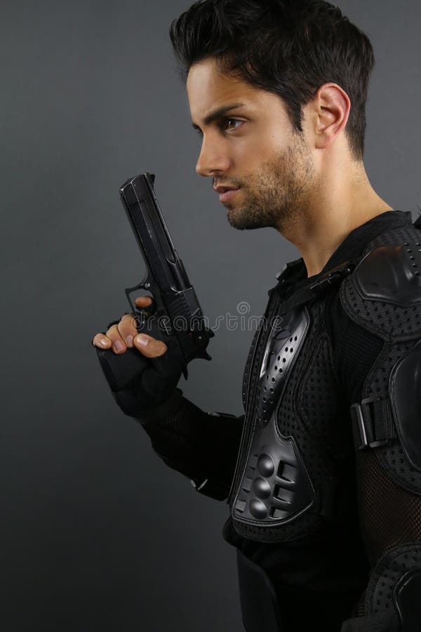 Super Cops - Handsome Man Posing with a Gun Stock Photo - Image of ...