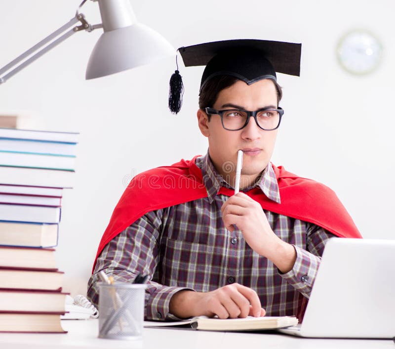 Super Hero Student Wearing a Mortarboard Studying for Exams Stock Photo ...