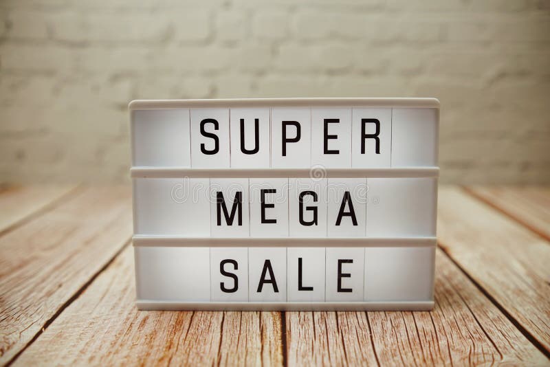 Super Mega Sale Word in Light Box on Wooden Background Stock Image ...