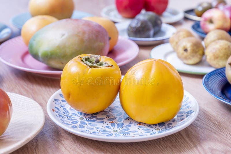Gold Persimmons with a Working Farmer Stock Photo - Image of nutrition ...