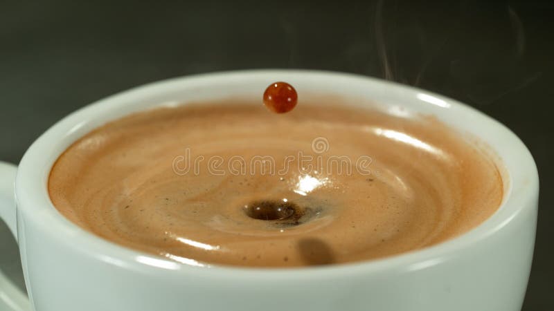 Super Slow Motion Detail Shot of Coffee Drop Falling into Fresh ...
