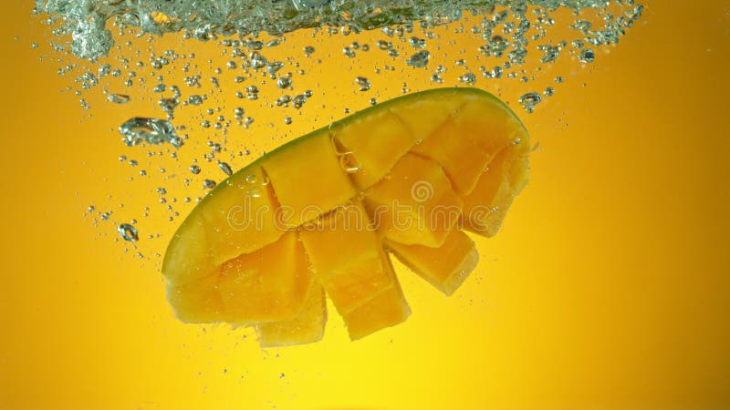 Super Slow Motion of Falling Fresh Mango into Water Stock Footage ...