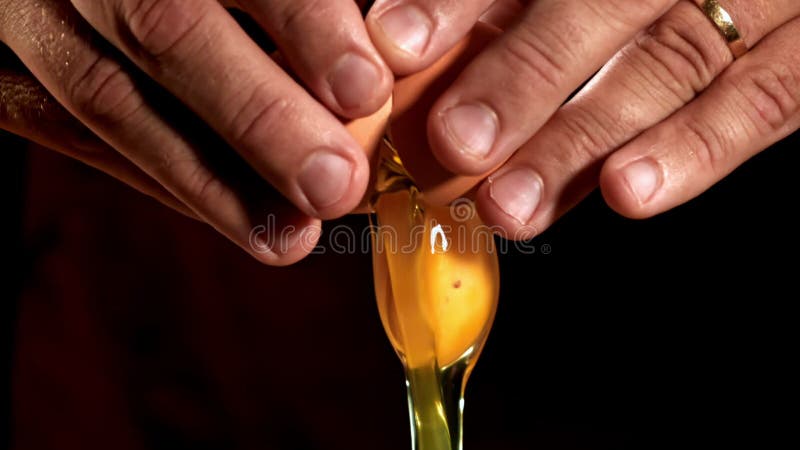 Super Slow Motion Hands of a Man with a Falling Raw Egg Stock Footage ...