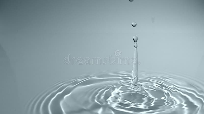 Water Drop in Super Slow Motion, Water Drop Falling in Blue Water Stock ...