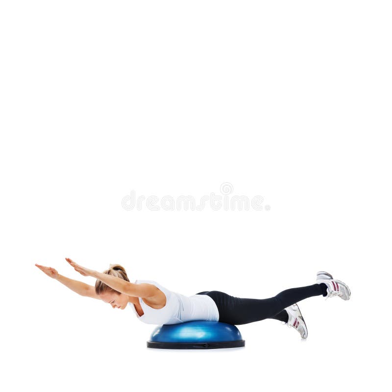 The Super Woman Workout. a Young Woman Working Her Core on a Bosu-ball ...