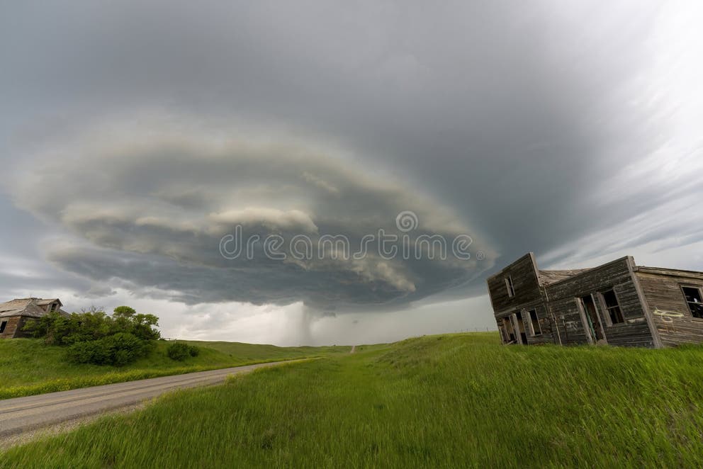 Supercell Storm Forming Over Abandoned Buildings and Prairie Fields ...