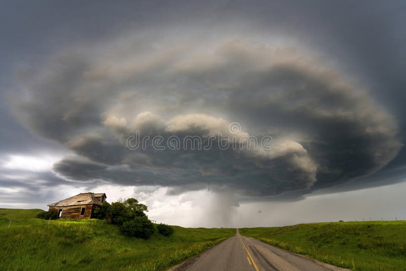 Supercell Storm Forming Over Abandoned Farmhouse and Country Road Stock ...