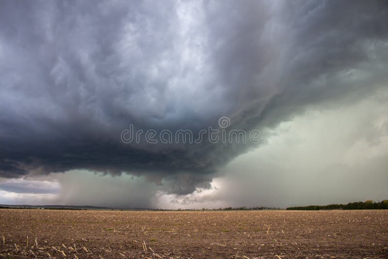 A Supercell Thunderstorm Dumps Heavy Rain and Hail Over a Field. Stock ...