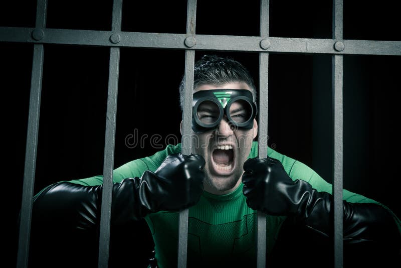 Superhero locked in prison stock photo. Image of prison - 46268272