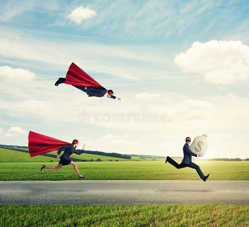 Superheroes Trying To Catch a Thief Stock Image - Image of mask ...
