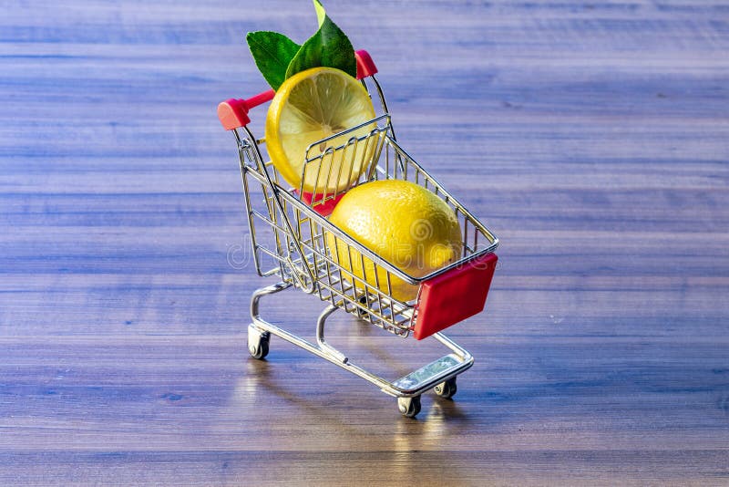 Supermarket Cart Carrying Green Leaf and Lemon. Stock Photo - Image of ...