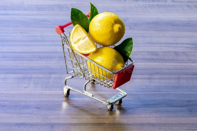 Supermarket Cart Carrying Green Leaf and Lemon. Stock Photo - Image of ...