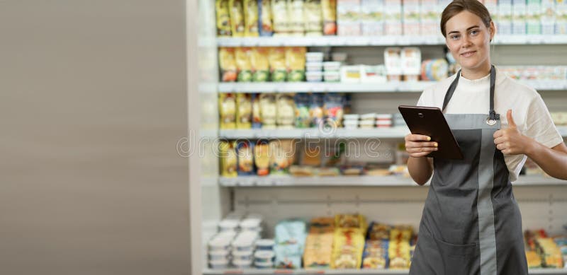 Supermarket Clerk Using Apps on a Digital Tablet, Innovative Technology ...