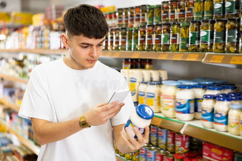 In Supermarket Man Scans Qr Code from Mayonnaise Label Stock Photo ...