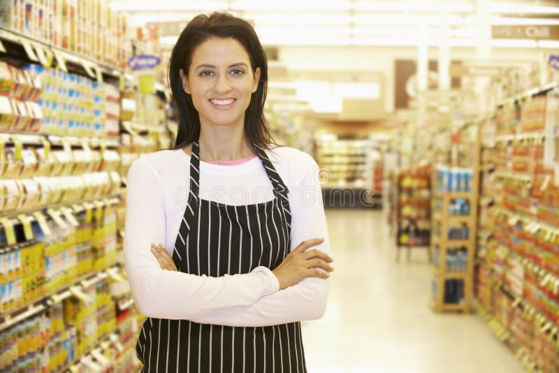 Supermarket Worker Standing in Grocery Aisle Stock Photo - Image of ...