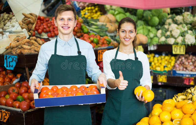 Smiling Supermarket Workers in Fruit and Vegetables Section Stock Photo ...