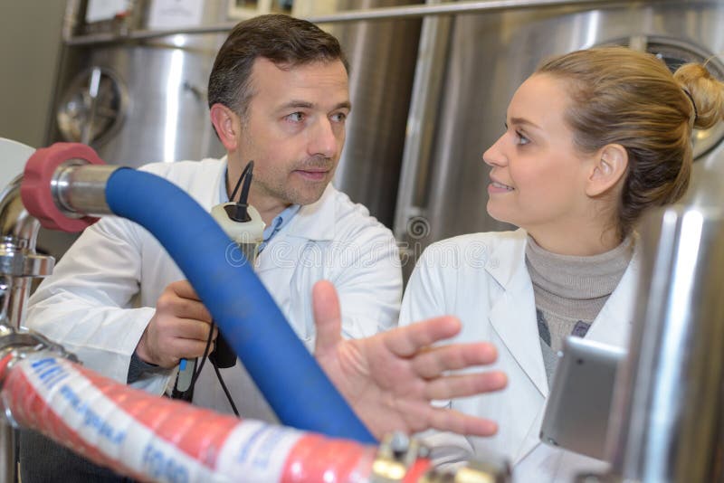 Supervising New Hired Worker Stock Image - Image of retailer, container ...