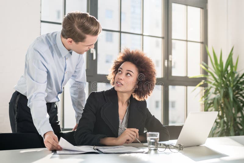 Supervisor Checking Statistics and Explaining the Results Stock Photo ...