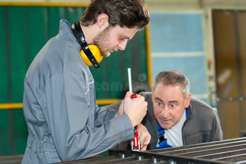 Supervisor Checking Work Apprentice Engineer in Factory Stock Photo ...
