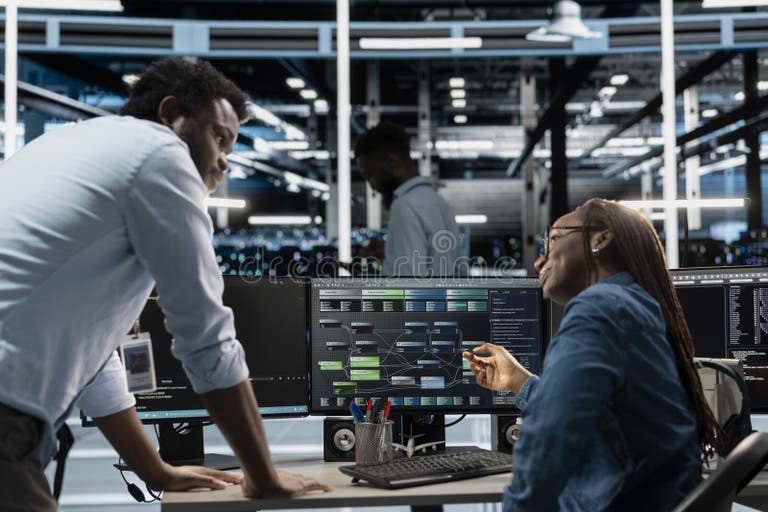 Supervisor Checking Work Done by Engineer Programming in Server Hub ...
