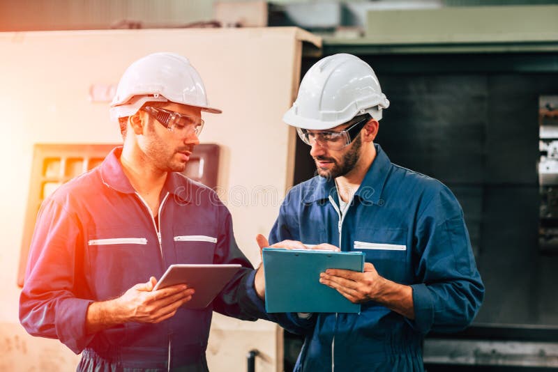 Supervisor Engineering Team Working Together in Heavy Industry, Check ...