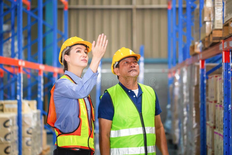 Supervisor Making Plans with Foreman Worker, Workers Working in ...