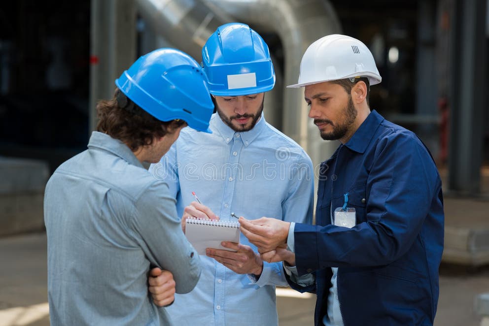 Supervisor and Manual Workers Discussing in Industry Stock Image ...