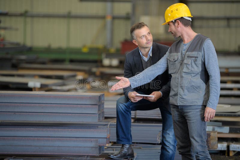 Supervisor and Production Worker Talking Stock Photo - Image of talking ...