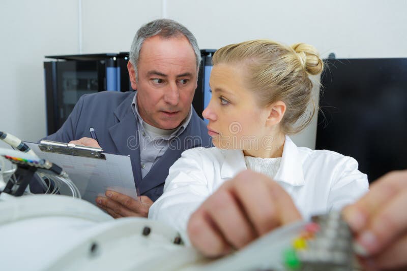 Supervisor Questioning Young Apprentices Work Stock Image - Image of ...