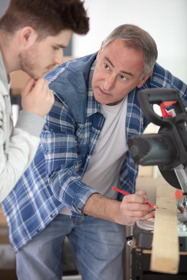 Supervisor Showing Apprentice How To Use Circular Saw Stock Photo ...