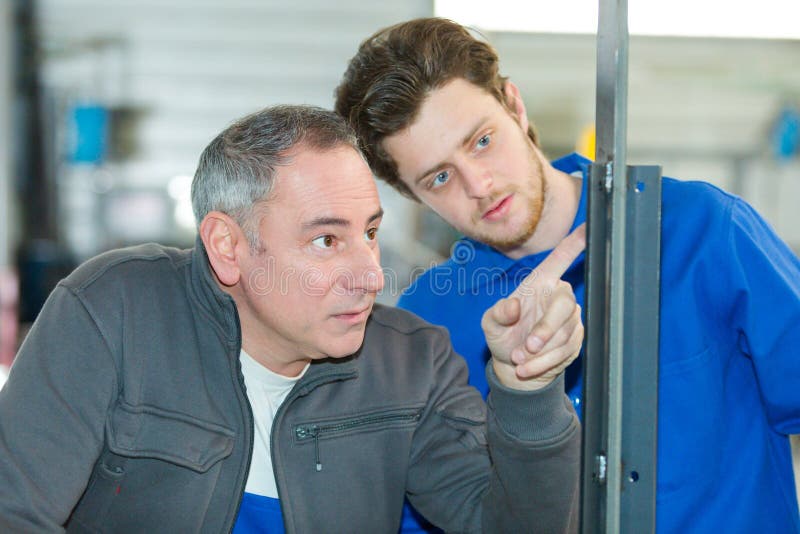 Supervisor Showing Metal Support To Apprentice Stock Image - Image of ...