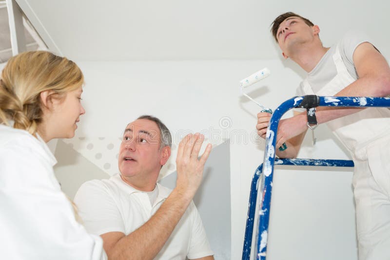 Supervisor Teaching Young Decorating Team Stock Image - Image of roller ...