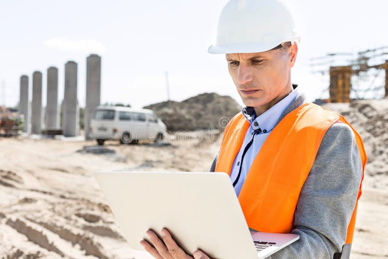 Supervisor Using Laptop at Construction Site on Sunny Day Stock Image ...