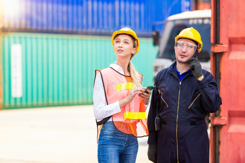 The Supervisor Wearing a Safety Suit is Controlling the Movement of ...