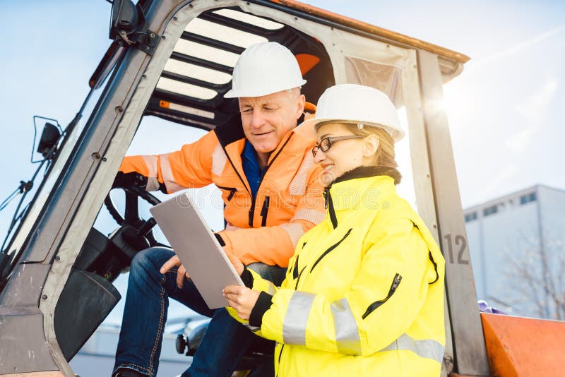 Supervisor Instructing Forklift Driver What To Work on Next Stock Image ...