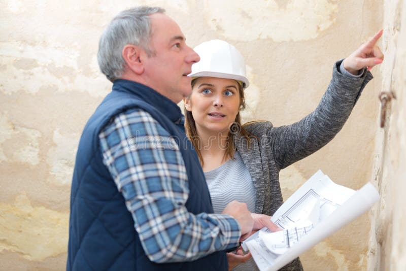 Supervisor and Worker at Indoors Wall Stock Image - Image of laborer ...
