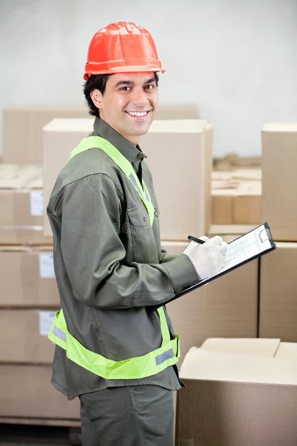 Supervisor Writing Notes at Warehouse Stock Photo - Image of clipboard ...