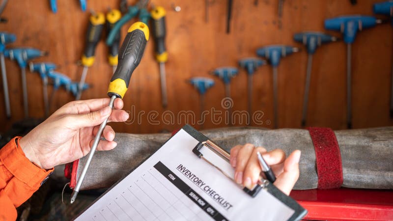 Perform Inventory Checklist in Factory Warehouse. Stock Image - Image ...