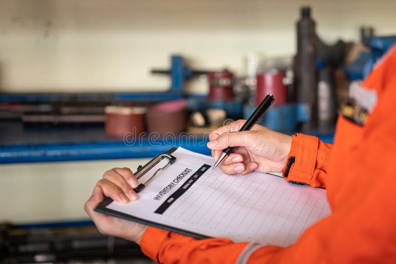 Perform Inventory Checklist in Factory Warehouse. Stock Image - Image ...