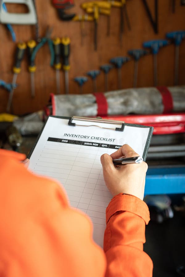 Perform Inventory Checklist in Factory Warehouse. Stock Photo - Image ...