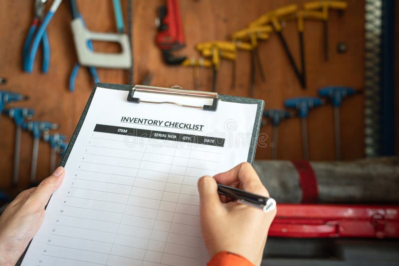 Perform Inventory Checklist in Factory Warehouse. Stock Photo - Image ...