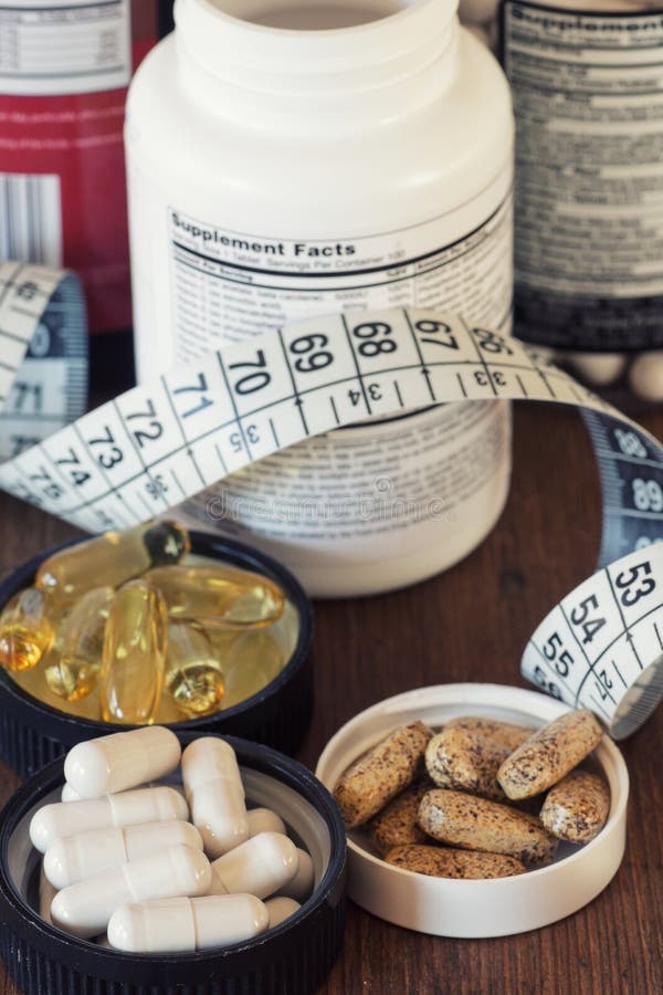 Supplementi Nutrizionali in Capsule E Compresse, Su Fondo Di Legno ...