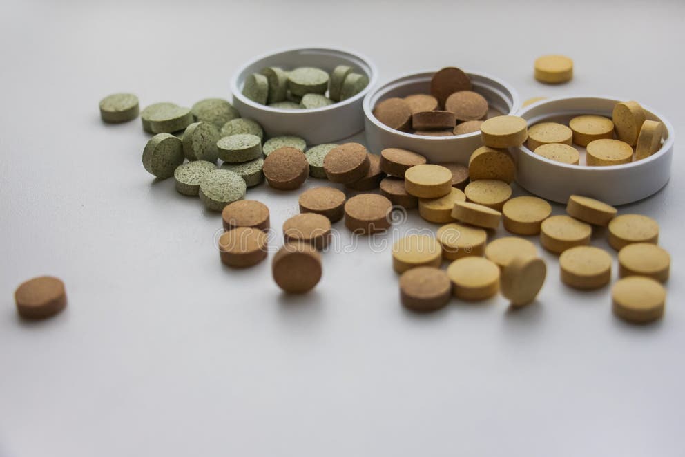 Supplements in Containers are Scattered on the Table Close-up Stock ...